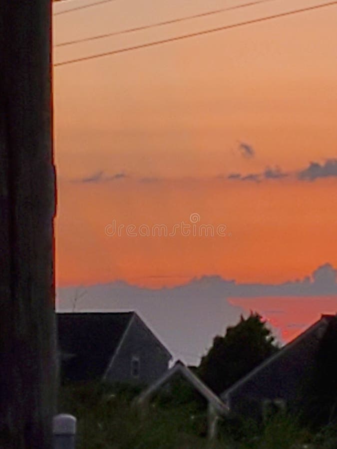 Glowing red sun over home stock photo. Image of wood - 188901784