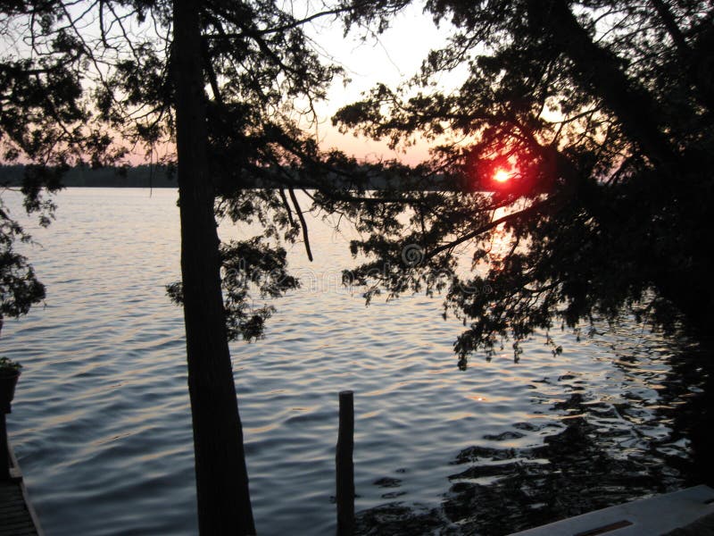 Glowing Red Sunset stock image. Image of water, lake - 256953237