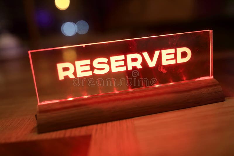 Glowing Sign Reserved stock image. Image of neon, exclusive - 142228081