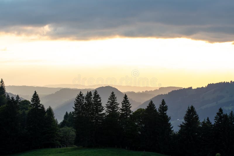 Glowing Sky before Sunset in German Alps with Hills and Trees in ...