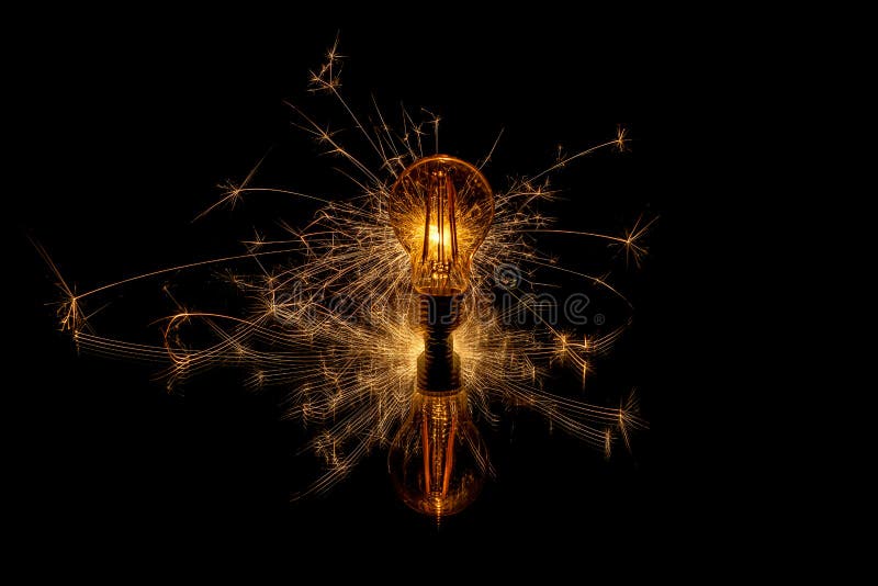 Glowing Sparkler Behind a Retro Light Bulb Stock Photo - Image of ideas ...