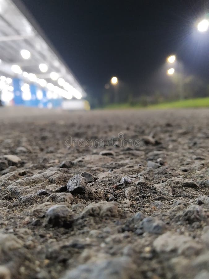 Glowing Stone at Night with a Beautiful Industrial Background with ...