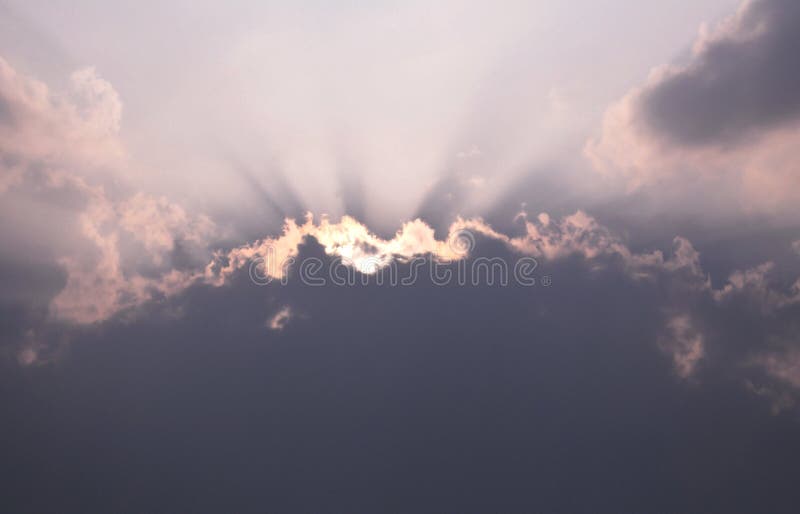 Glowing Sun Coming Out from the Dark Clouds Stock Photo - Image of ...