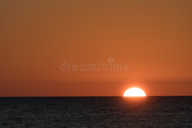 Glowing Sun Disk during Sunset at Indian Rocks Beach - 2 Stock Photo ...