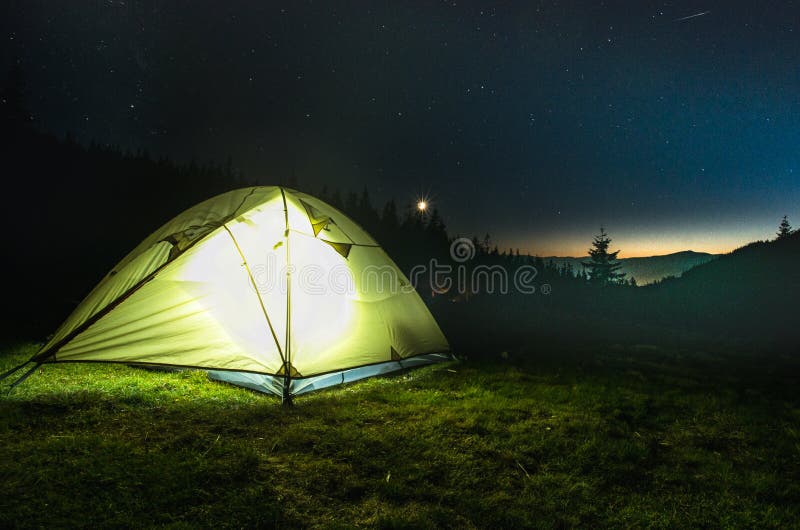 Glowing Tourist Tent in the Mountains. Tourist Tent and Night Landscape ...