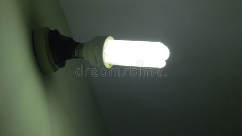 Glowing white light bulb stock image. Image of lamp - 141052335