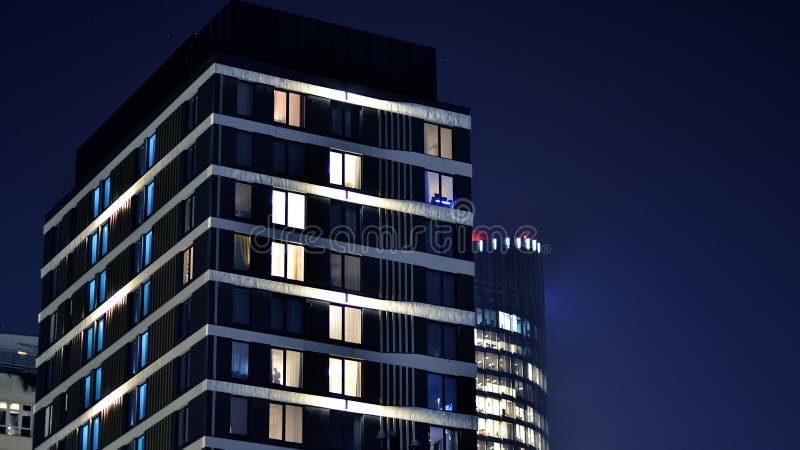 Glowing Windows of the Multi-storey Building in Night. Stock ...