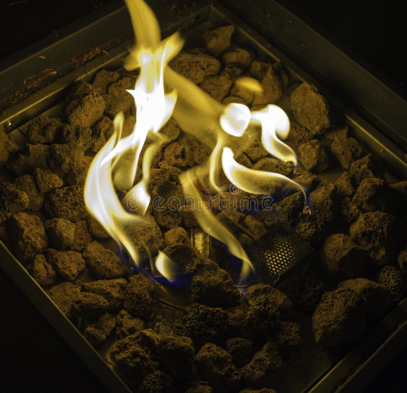 Abstract View of Fire Burning with Yellow Flames with a Wine Glass Near ...