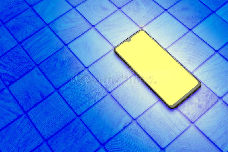Glowing Yellow Mobile Phone on a Checkered Tiled Dark Blue Surface ...
