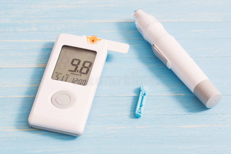 Glucometer and Blue Pen on Medical Forms for Diabetes Stock Photo ...