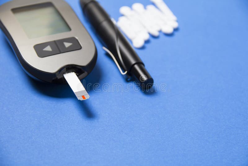 Blood Glucose Meter with a Needle. Measuring Blood Sugar Stock Photo ...