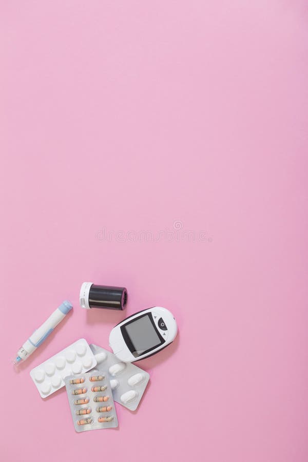 The Glucometer and Pills on Pink Background Stock Photo - Image of ...
