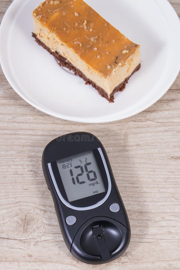Glucometer and Portion of Cheesecake. Measuring and Checking Sugar ...