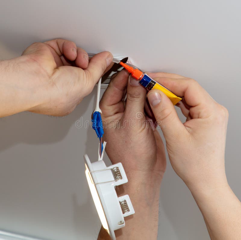 Gluing the Stretch Ceiling Where the Light Bulb Stock Photo - Image of ...