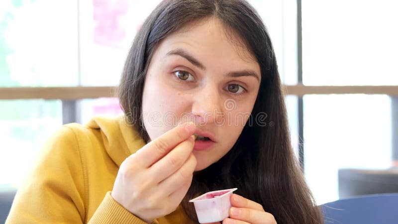 Glutton Woman Eating Cupcakes with Frenzy after Long Diet Stock Footage ...