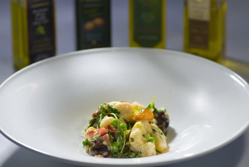 Gnocchi on a plate stock photo. Image of peas, olive - 14061922