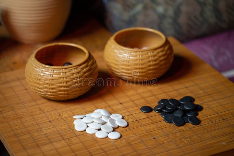 Go Board Game Playing. a Competitor is Placing a Marble Piece on a Go ...