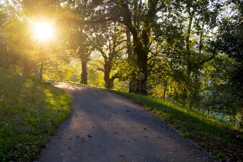 Go Down the Road with the Sun Stock Image - Image of dawn, movement ...