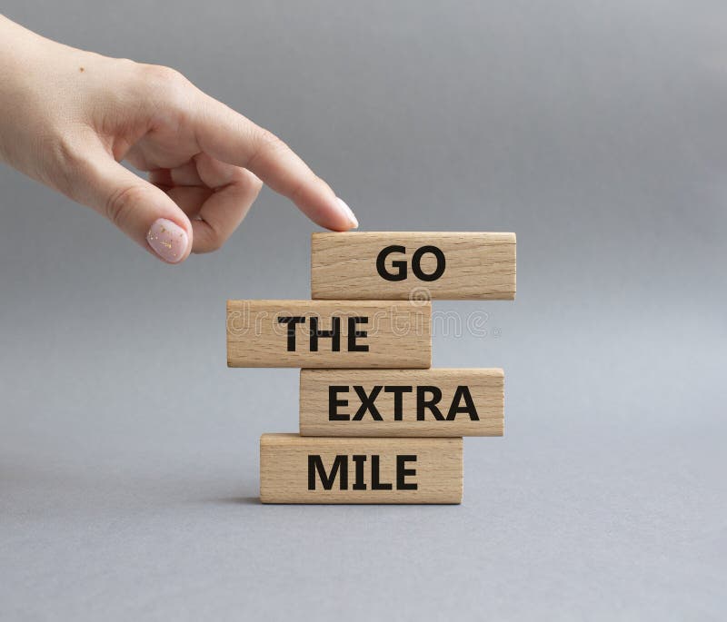 Go the Extra Mile Symbol. Wooden Blocks with Words Go the Extra Mile ... Go the Extra Mile Symbol. Wooden Blocks with Words Go the Extra Mile ...
