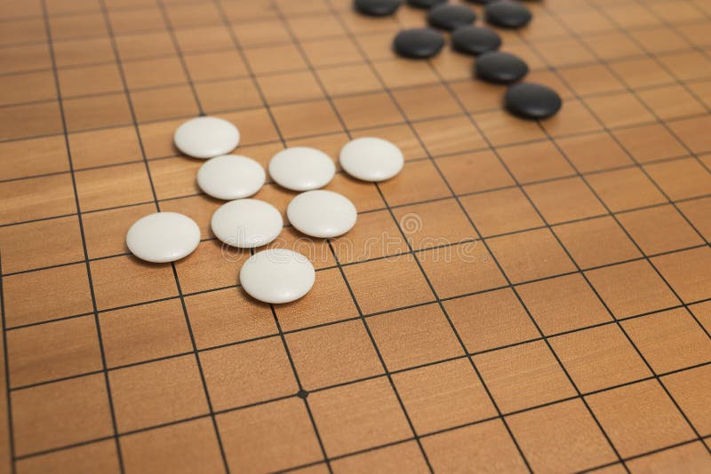 Black Go Game Stones On White Background Stock Photo - Image of round ...