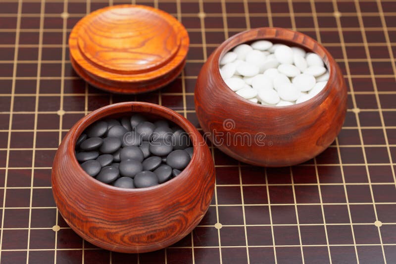 Go Game Stones in Wooden Bowl Stock Photo - Image of pack, playing ...