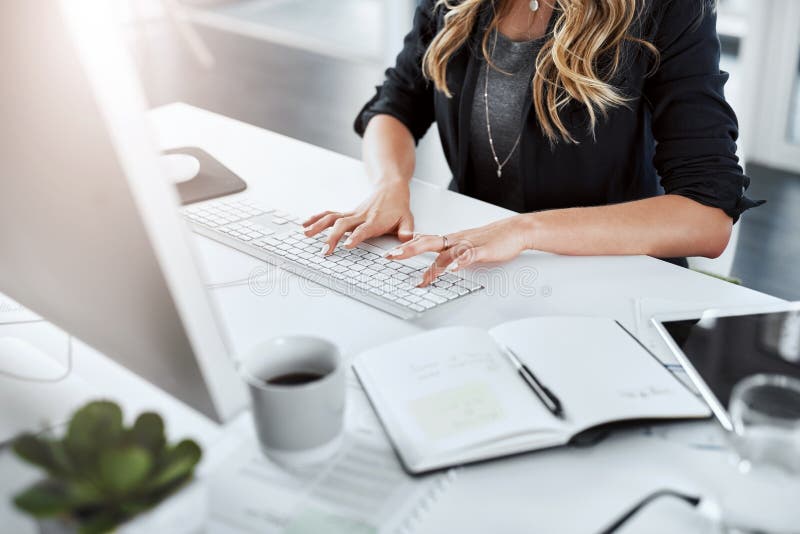 Go Getter Hands Hard at Work. a Businesswoman Using a Computer at Her ...