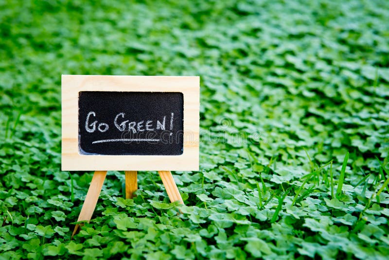 Go Green - Handwritten on Blackboard in Green Clover Stock Image ...