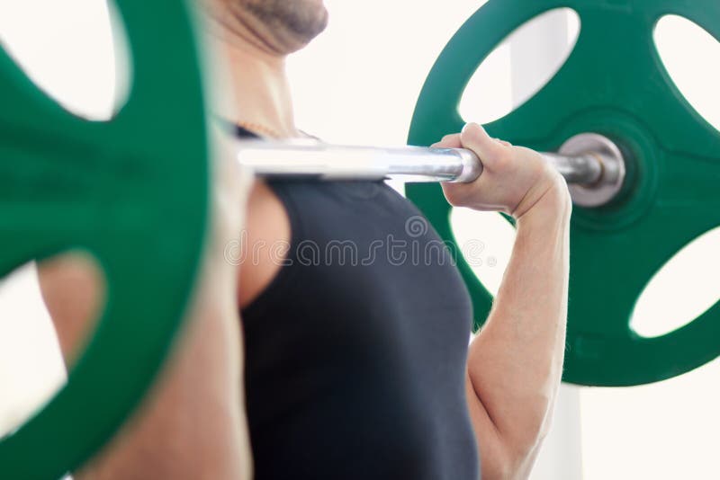 Go Heavy or Go Home. a Man Working Out with Weights in the Gym. Stock ...