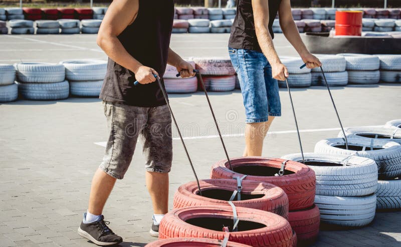 The Go Kart Racing Service Workers Moves Wheels at the Track Stock ...