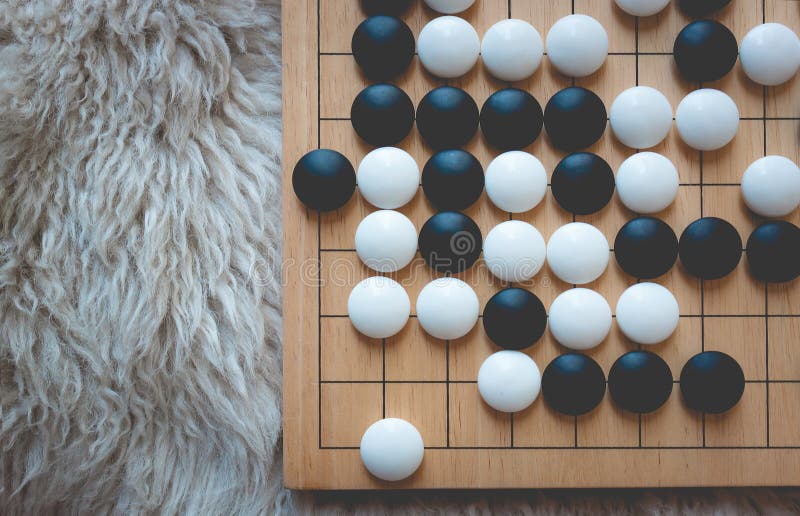 Go or Weiqi board game stock image. Image of activity - 68824857