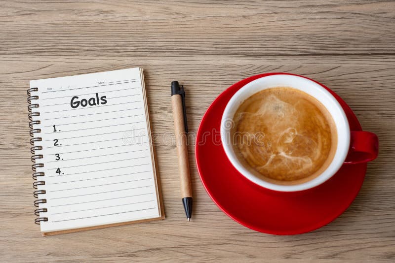 GOAL with Notebook and Coffee Cup on Wood Table. Motivation, Resolution ...
