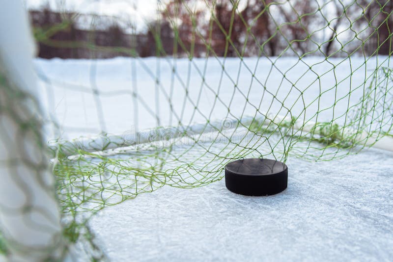 Goal Scored by a Hockey Puck in the Goal Net Stock Photo - Image of ...