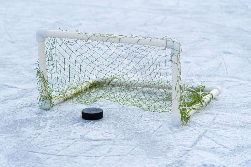 Goal Scored by a Hockey Puck in the Goal Net Stock Photo - Image of ...