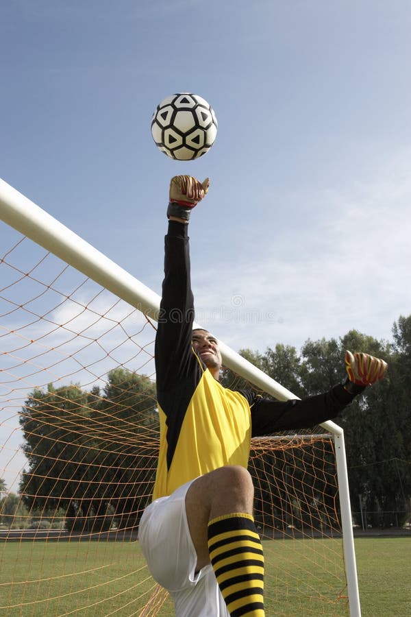 Goalkeeper Jumping Towards Ball Stock Photo - Image of ball, people ...