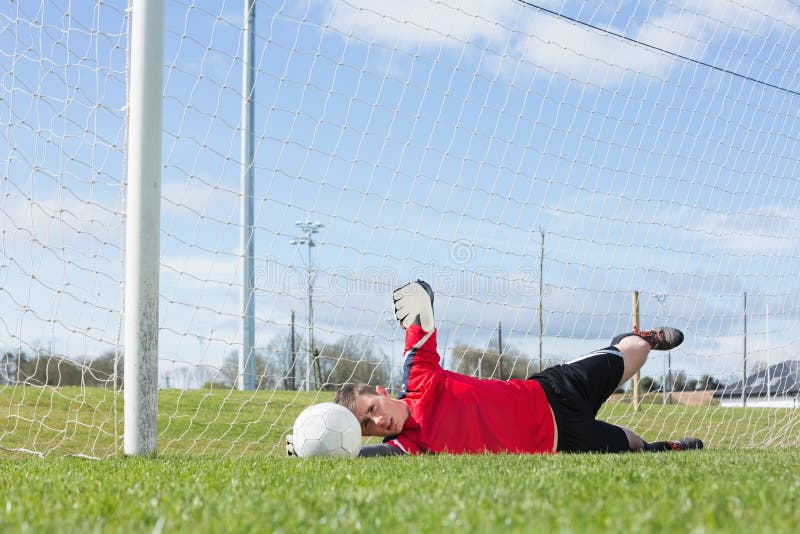 Goalkeeper in Red Making a Save Stock Image - Image of teenager ...