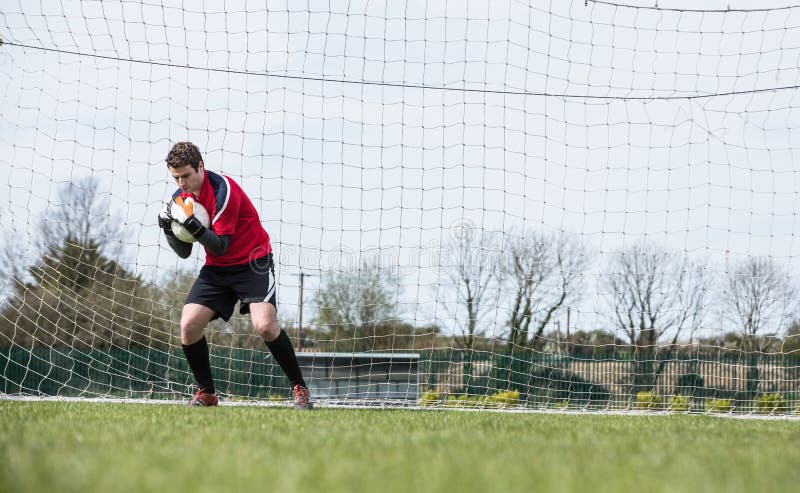Goalkeeper saving a goal stock image. Image of ball - 103603787