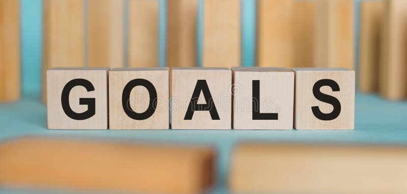 Goals Word Concept Building with Wooden Blocks on Blue Background Stock ...