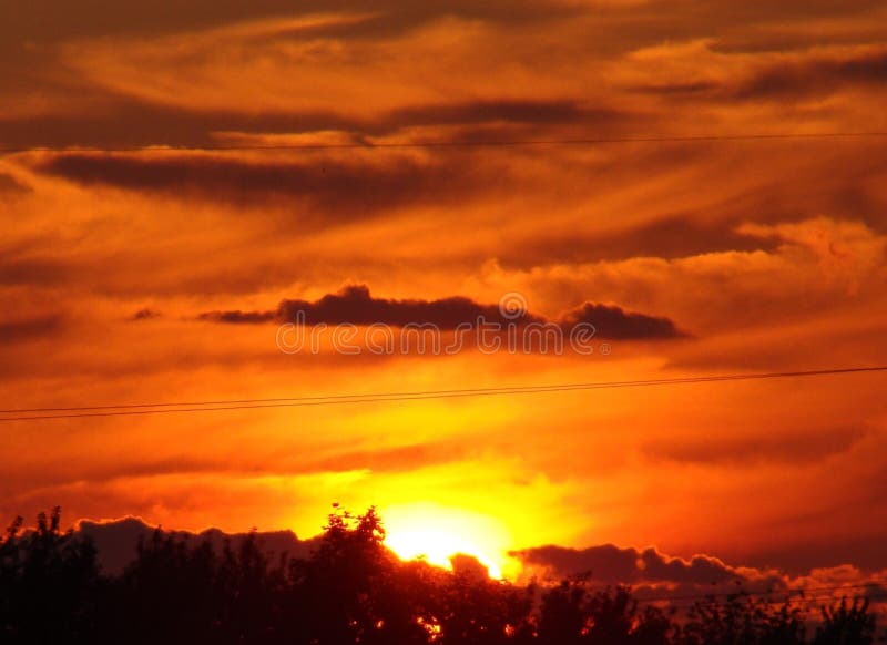 God Paints the Sky with Orange Swirls, at Sunset Stock Photo - Image of ...