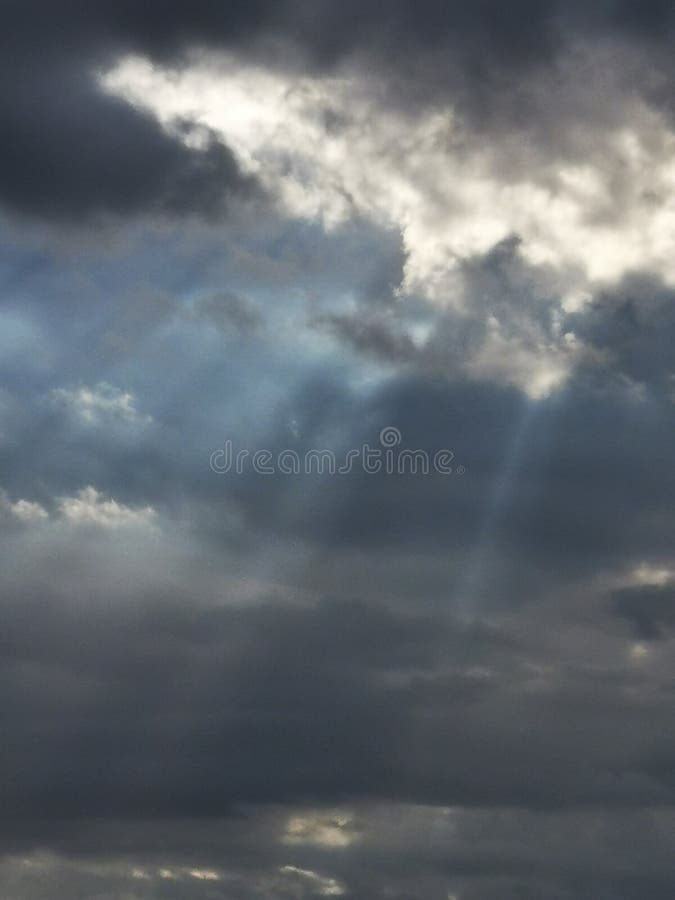 God rays through clouds stock photo. Image of wave, evening - 203677136