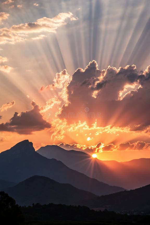 God Rays during Sunset Over Mountain Silhouette Stock Illustration ...