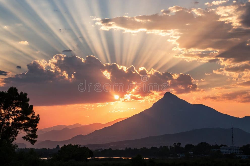God Rays during Sunset Over Mountain Silhouette Stock Illustration ...