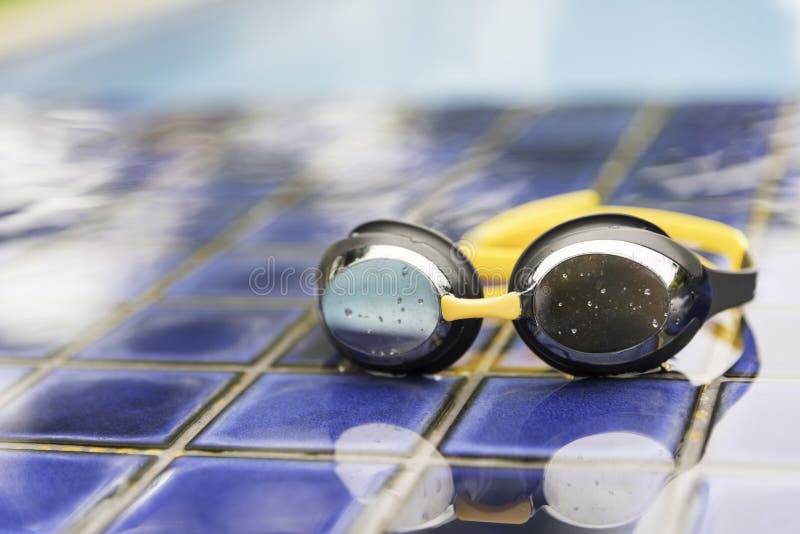 Goggles on the Side of a Swimming Pool Stock Image - Image of ...
