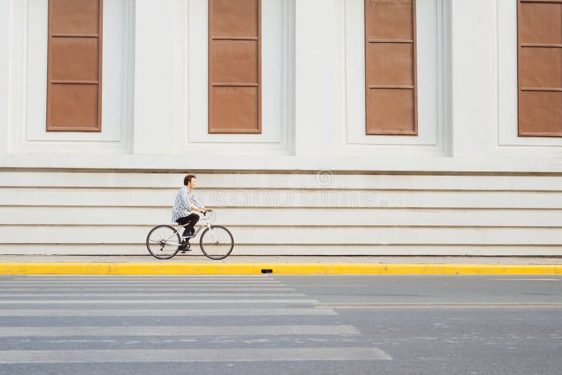 Going Everywhere by His Bike. Side View of Young Businessman Looking ...