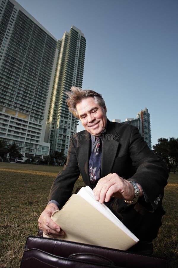 Going through files stock image. Image of grass, smile - 7450081