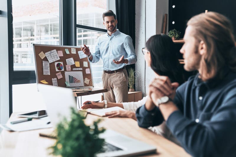 Going Over Details. Group of Young Business People Using Blackboard ...