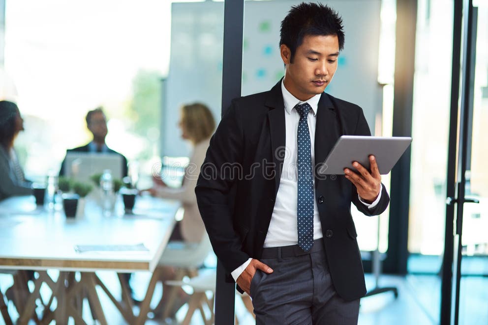 Going Over His Notes before the Meeting. a Handsome Young Man Using a ...