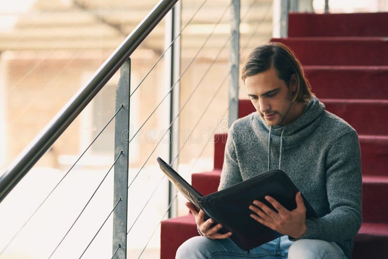 Going Over His Study Notes. a Handsome Young University Student ...