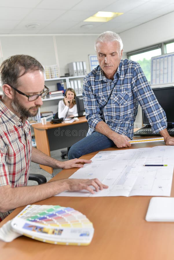 Going over plans together stock photo. Image of reviewing - 94040188