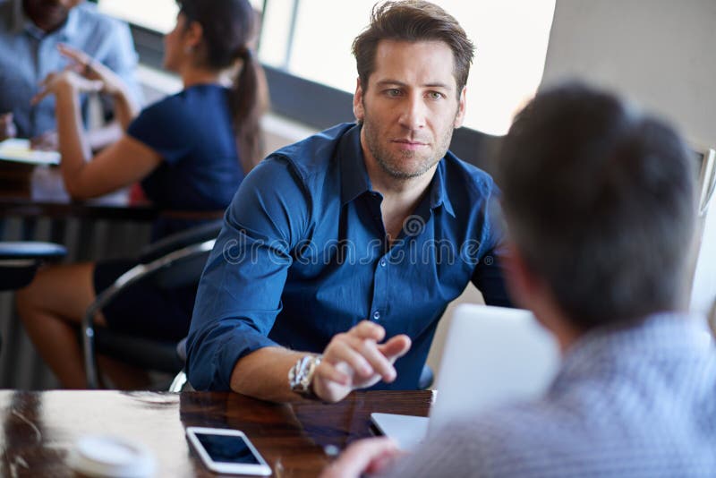 Going Over Some Ideas. Two Businessmen Talking in an Office. Stock ...