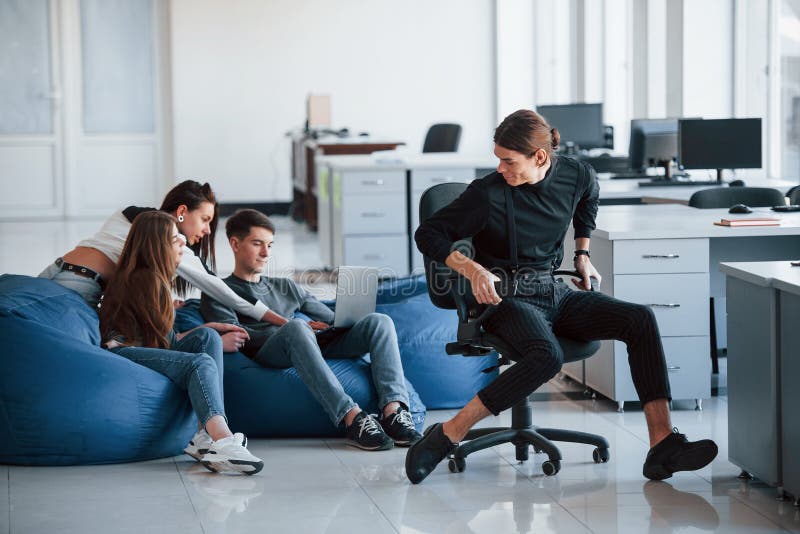 Going To the Computer. Group of Young People in Casual Clothes Working ...